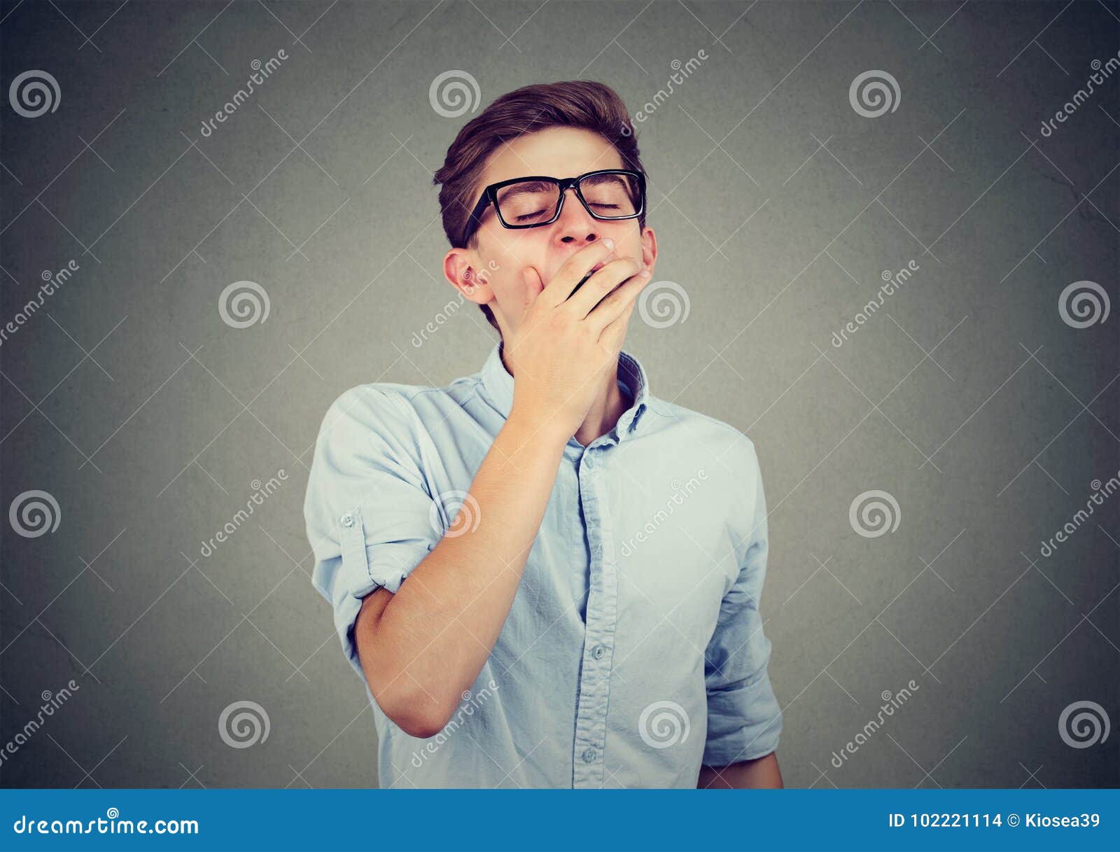 Man Yawning with Hand Over His Mouth Stock Photo - Image of hand, eyes ...