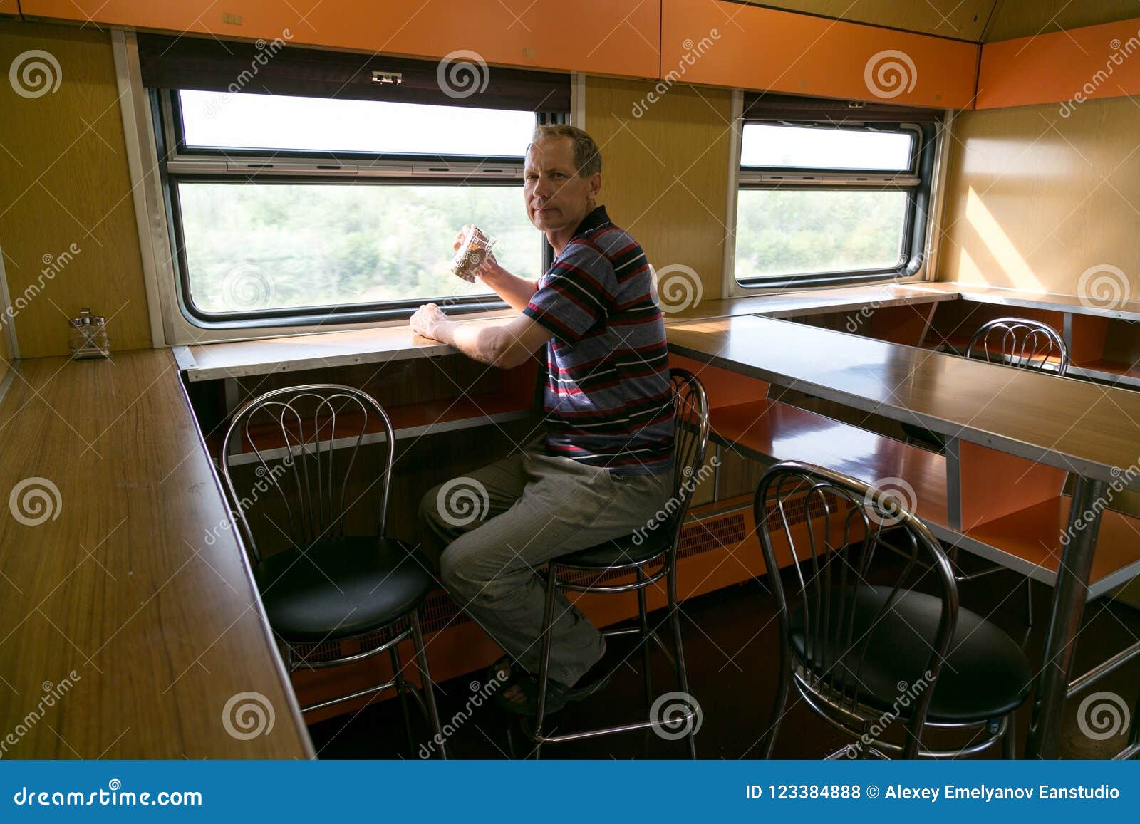 A Man is Riding in a Train Restaurant. Stock Photo - Image of road ...