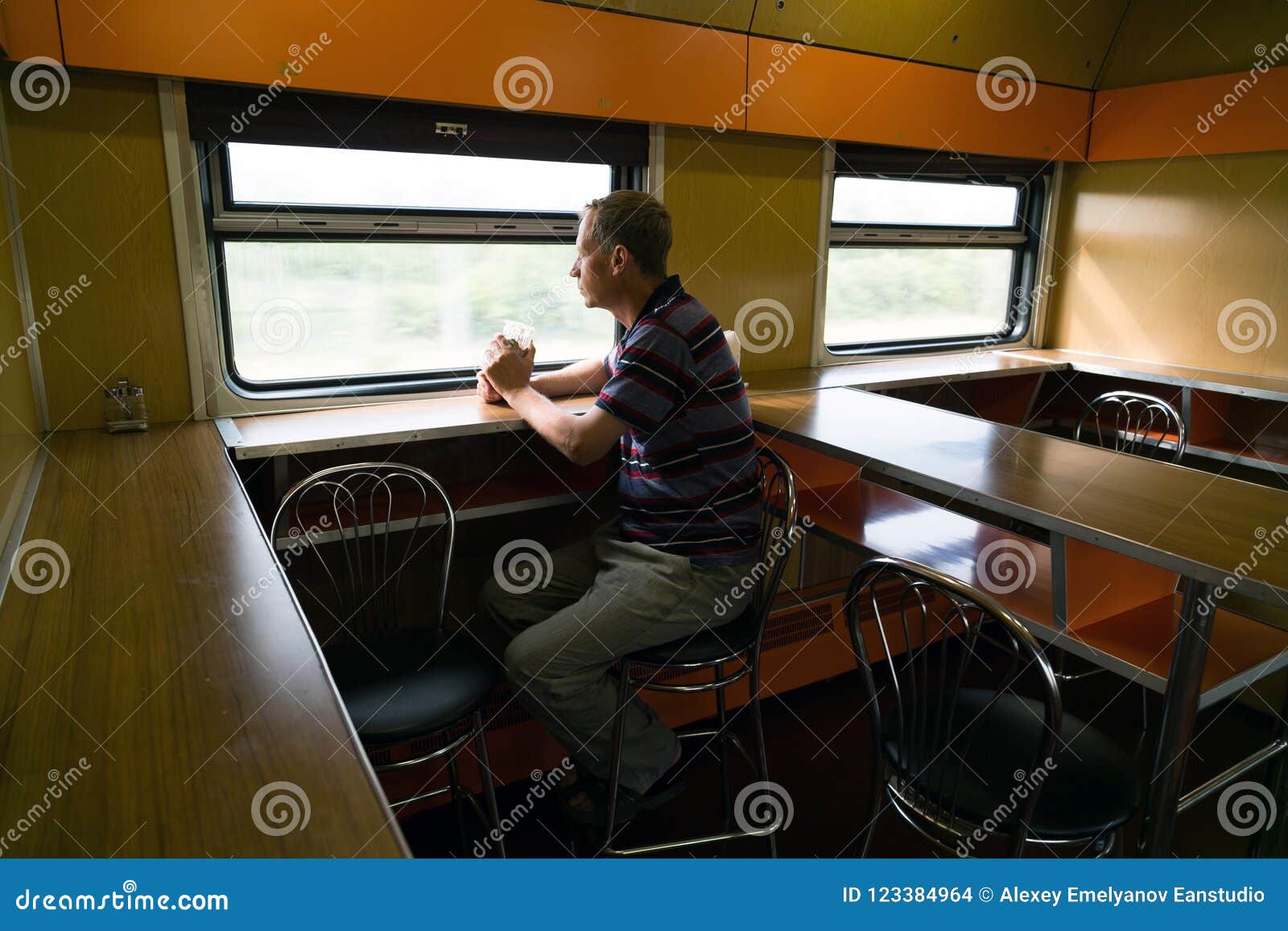 A Man is Riding in a Train Restaurant. Stock Photo - Image of food ...