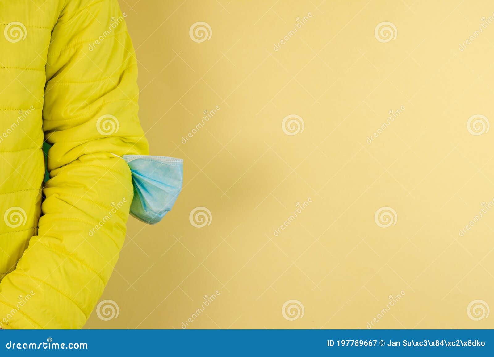 Man in Yellow Jacket is Using a Protective Mask Against Corona Virus on ...