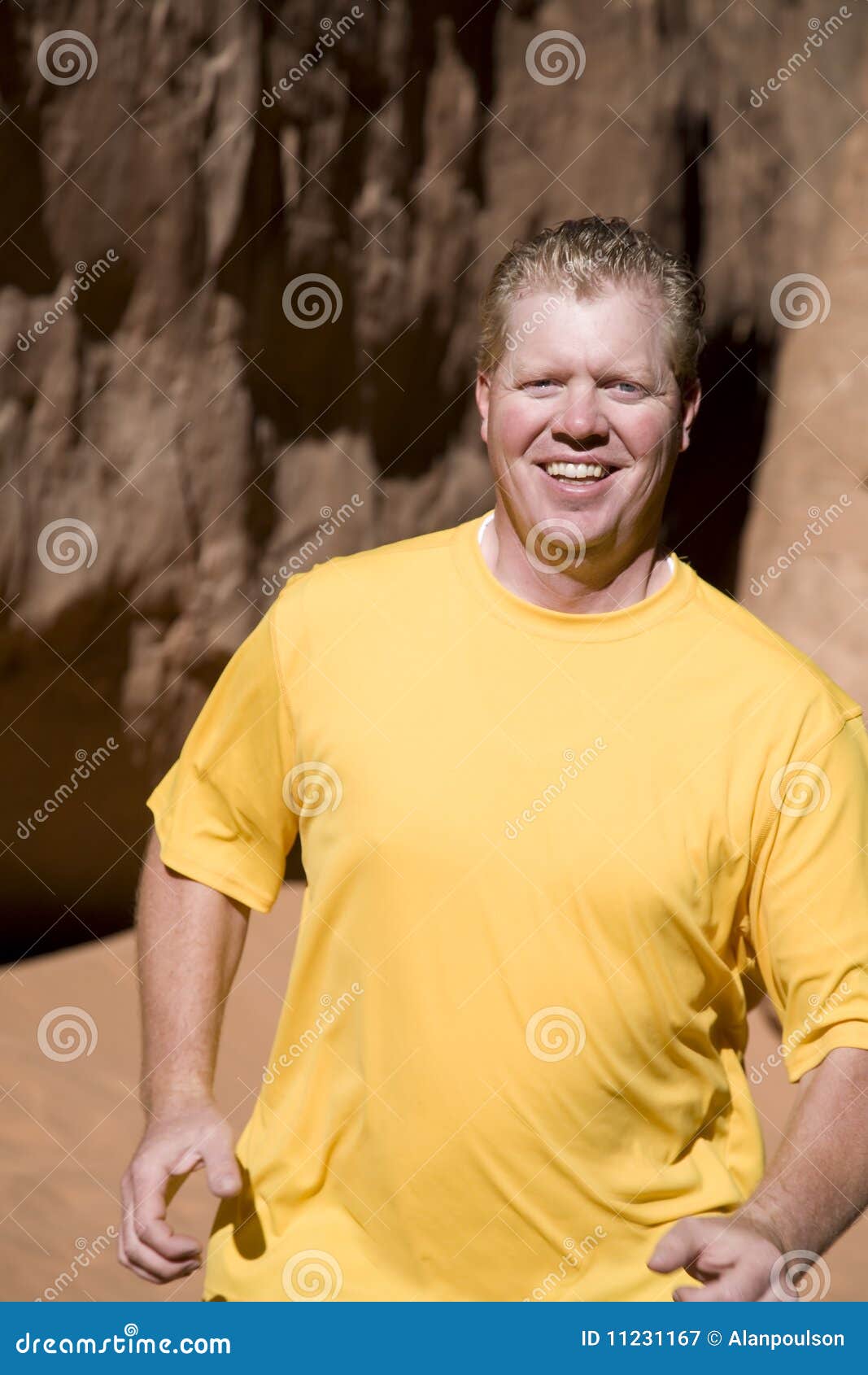 Man in yellow shirt stock image. Image of workout, shorts - 11231167