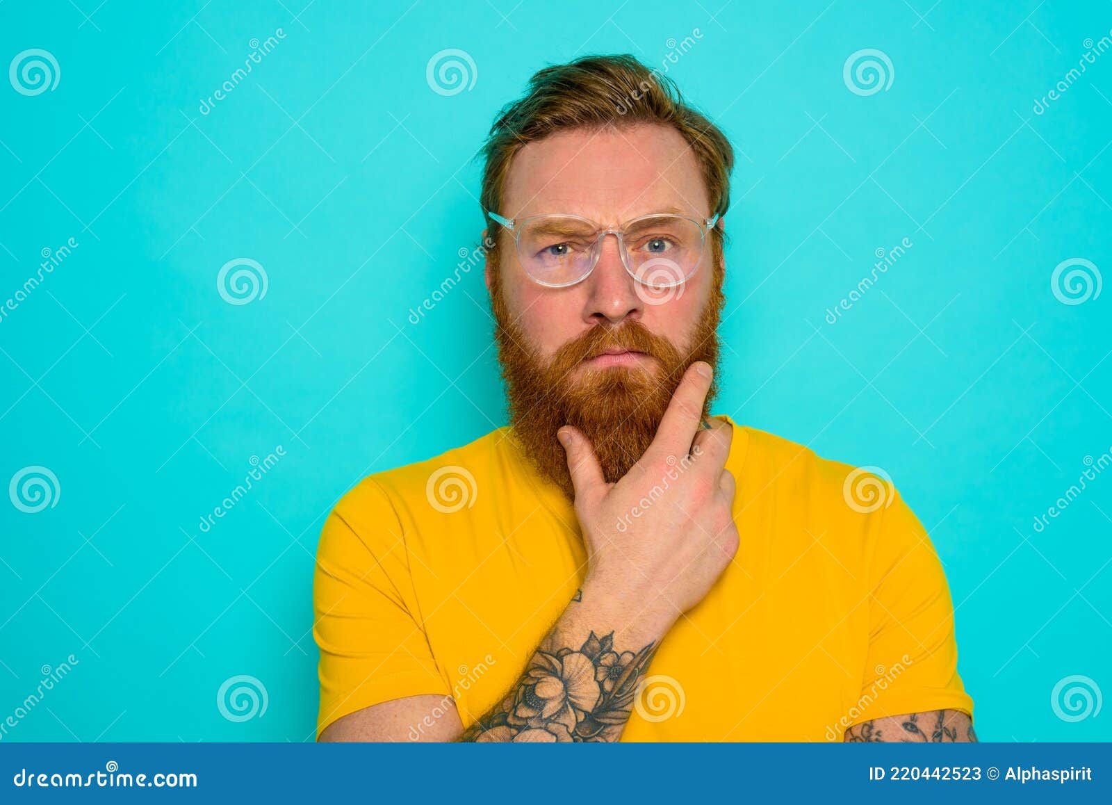 Undecided Man With Beard And Tattoo Is Ready To Draw With Brushes