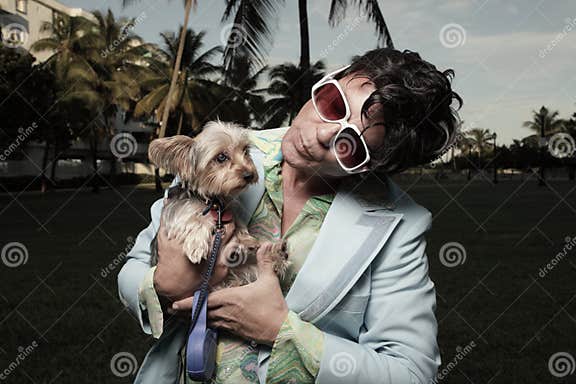 Man and a Yorkie stock image. Image of interaction, hippie - 11504487