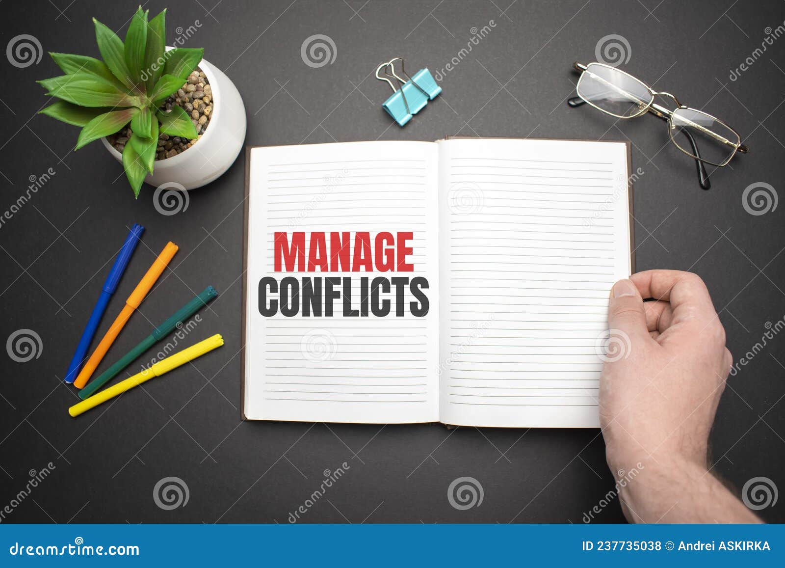 MANAGE CONFLICTS Text on the Notebook with Businessman S Hands Stock ...