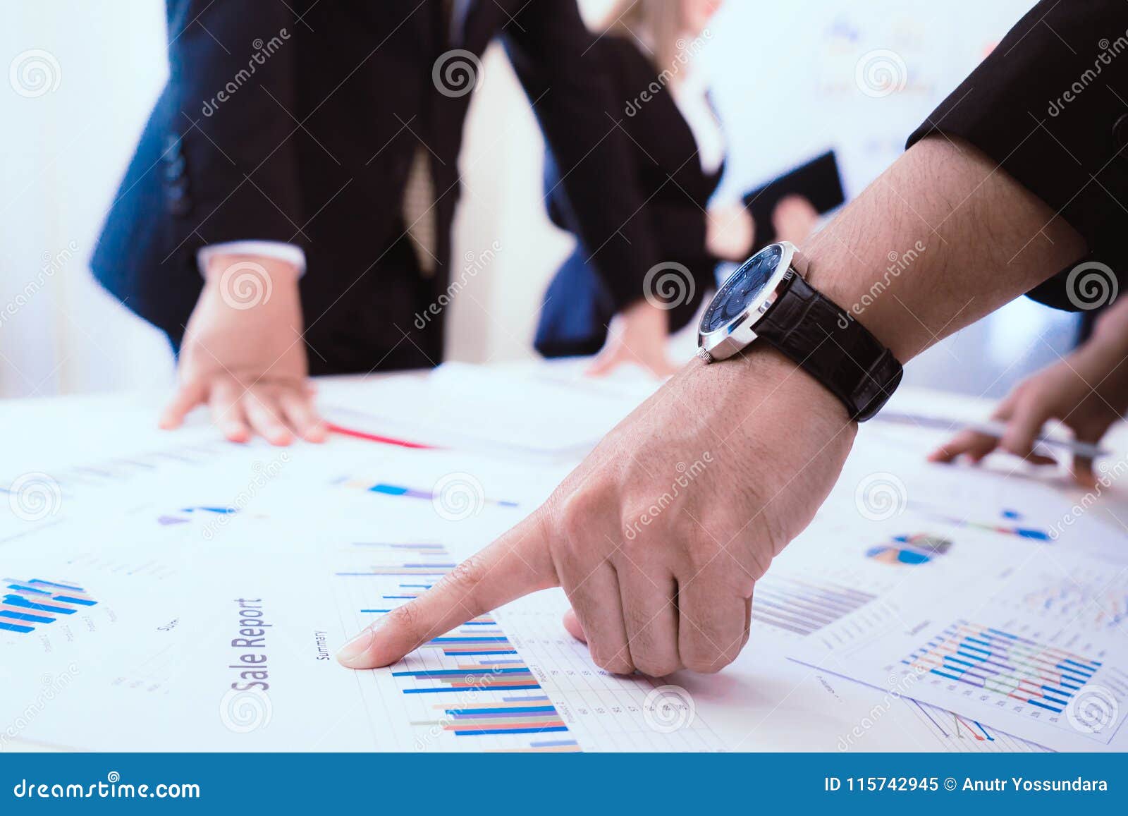 Team Meeting is Discussing Data Chart on the Table Stock Image - Image ...