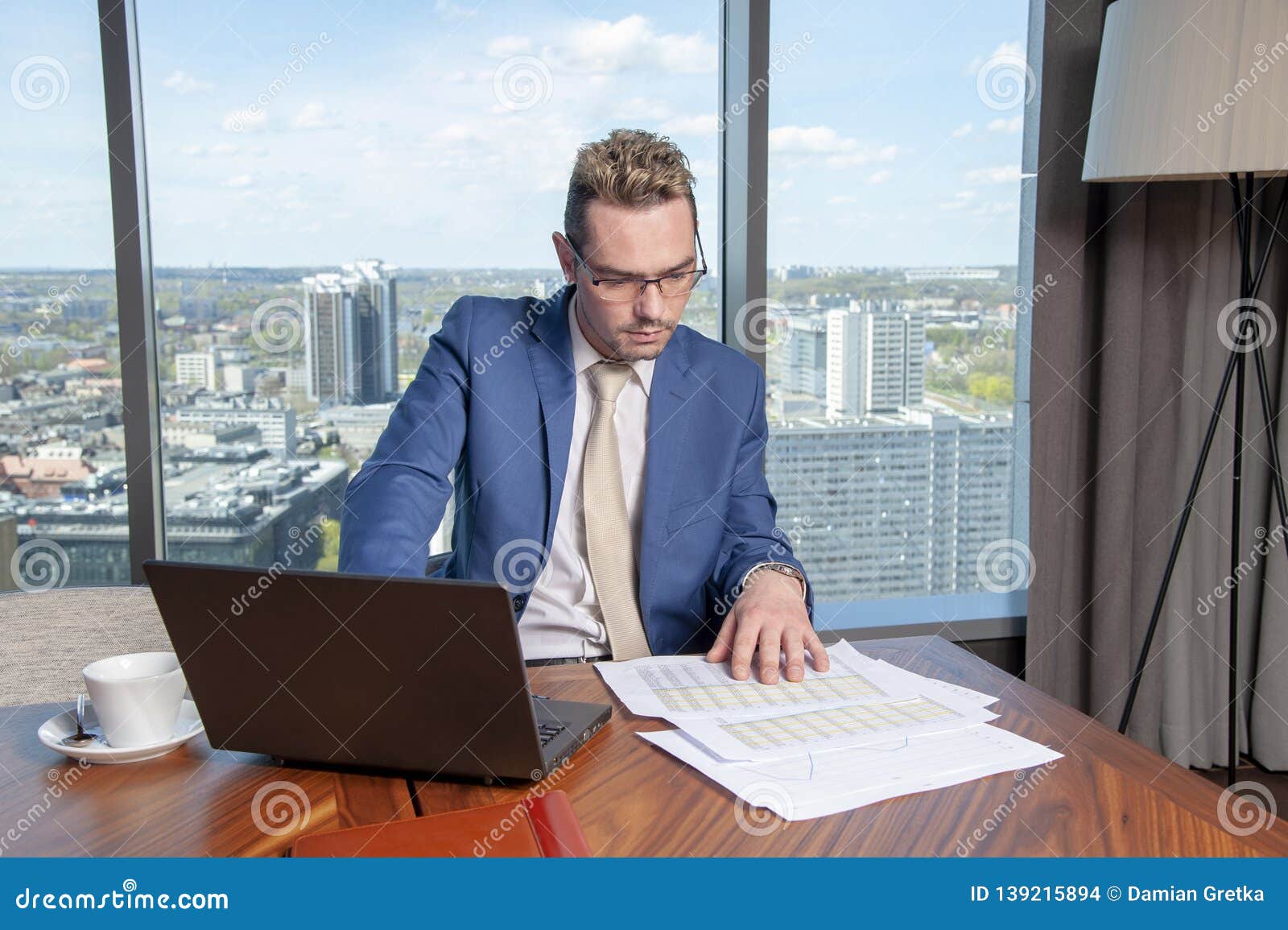 The Manager Behind the Desk in the Office Hard Work on the Data. Stock ...