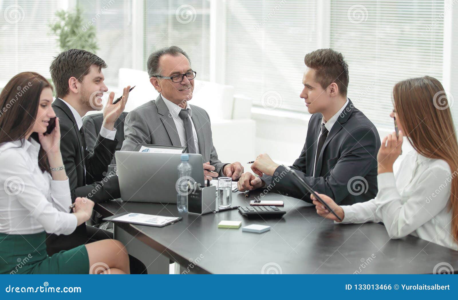 Manager and Business Group Discussing Financial Documents Stock Photo ...