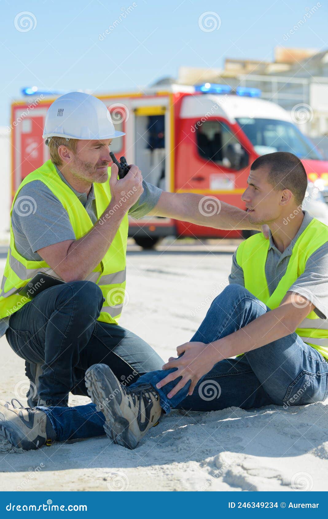 Manager Calling for Help for Construction Worker Injured at Work Stock ...