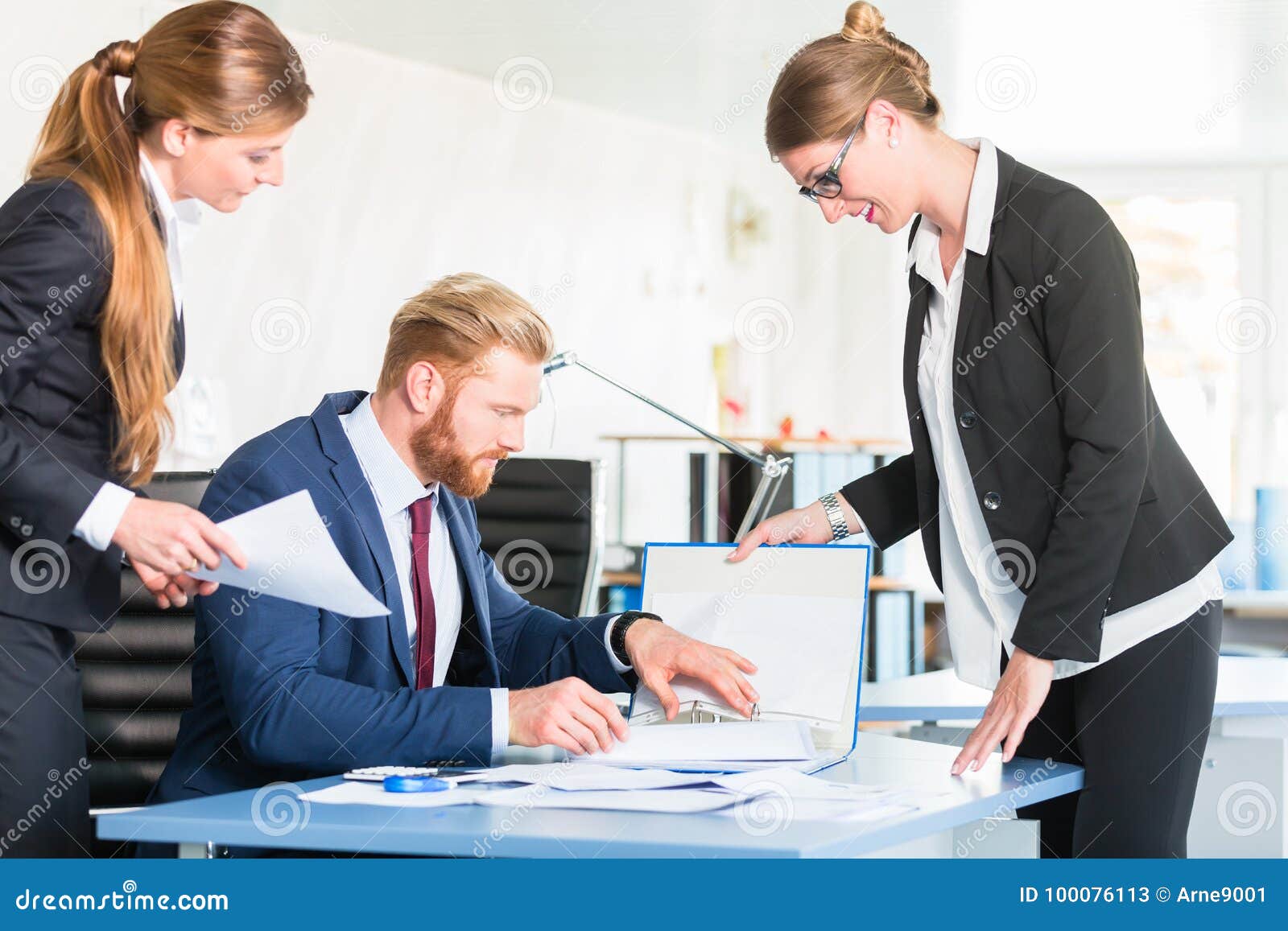 Manager Checking Documents in Front of Assistants Stock Image - Image ...