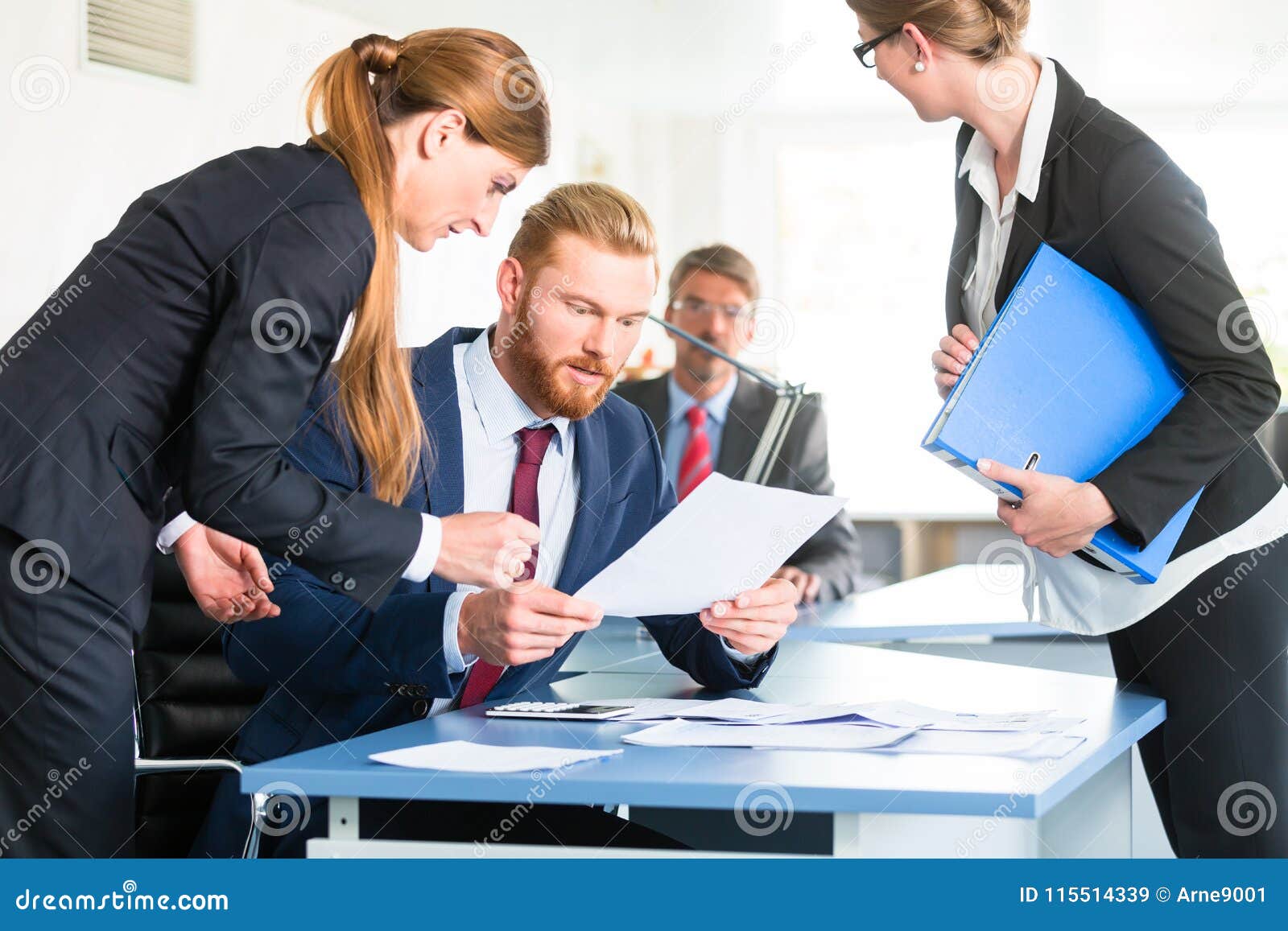 Manager Checking Documents in Front of Assistants Stock Image - Image ...