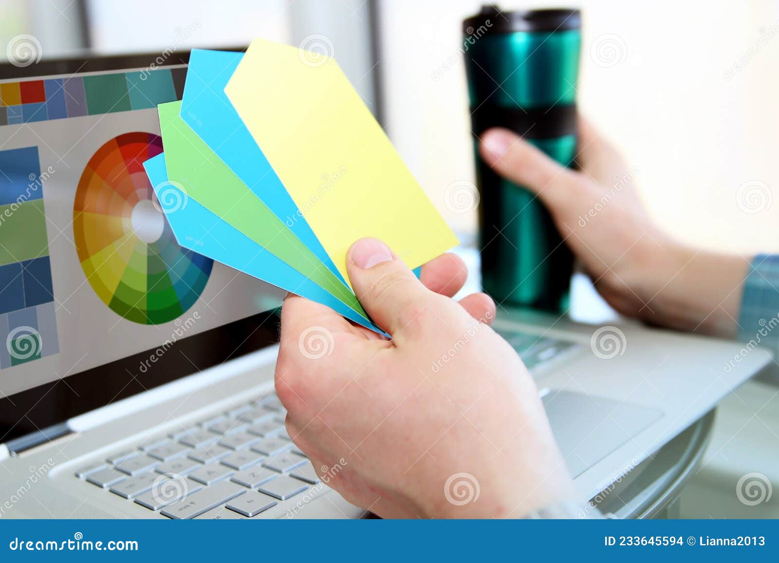 Manager is Choosing a Color on a Laptop for a Design Project Stock ...