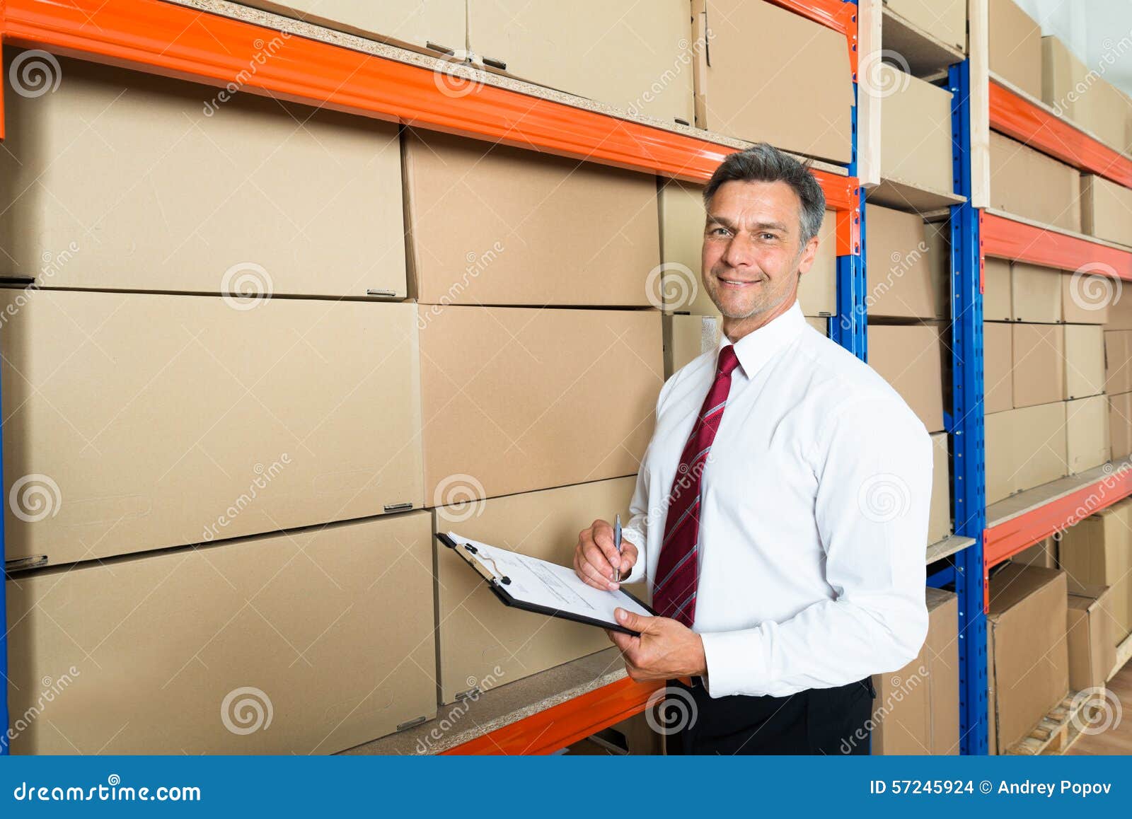 Manager with Clipboard in Distribution Warehouse Stock Photo - Image of ...