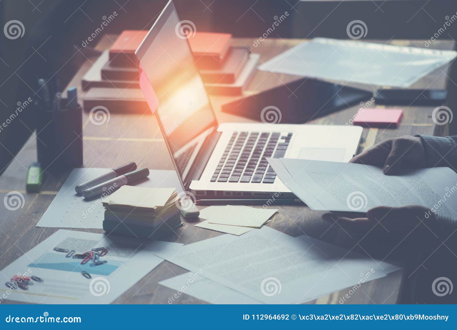 Manager with Computer and Paperwork Sitting at His Desk in Office ...