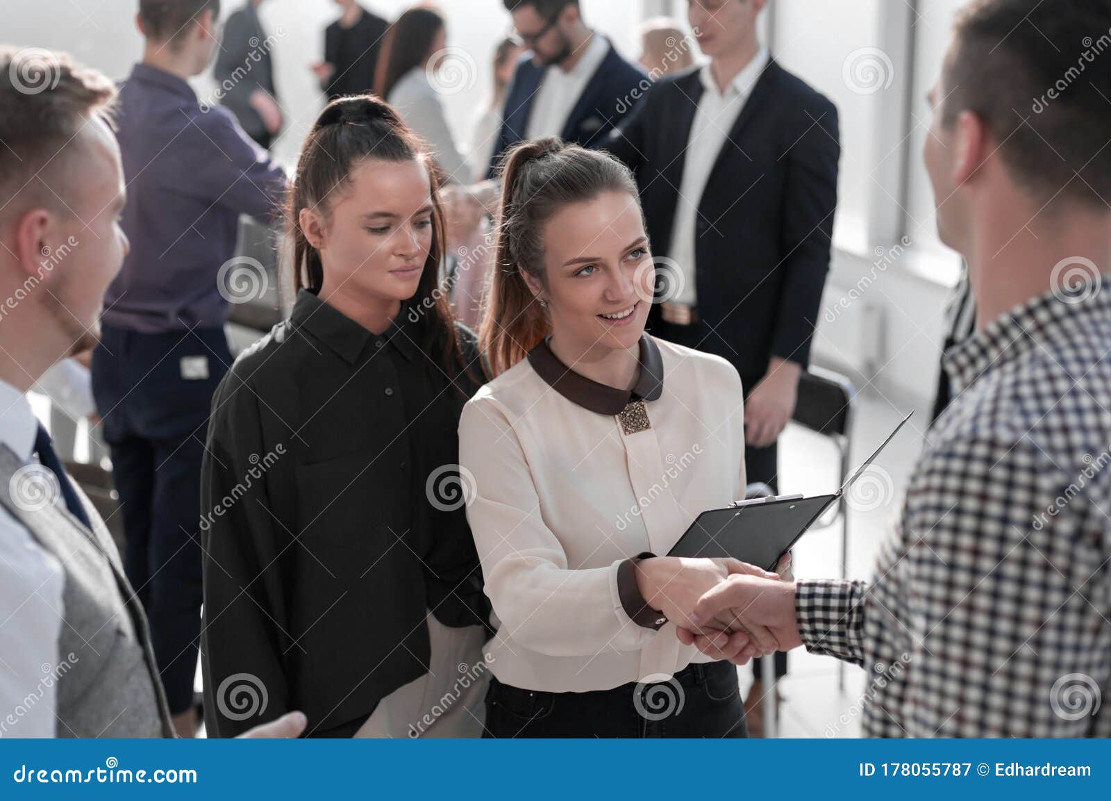Manager Congratulating a Young Employee with a Handshake Stock Image ...