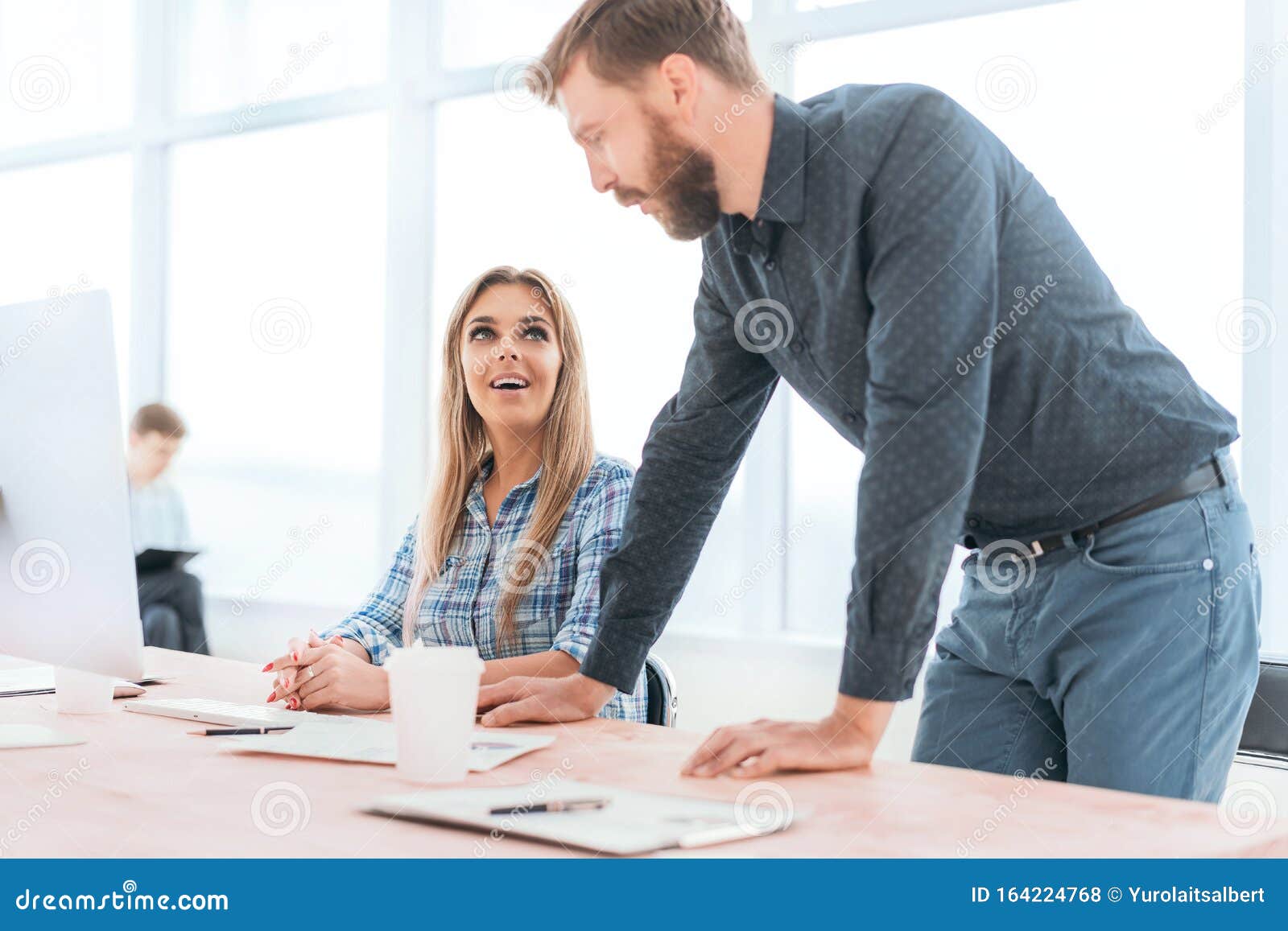 Manager Discussing with a Young Employee Working Documents Stock Photo ...