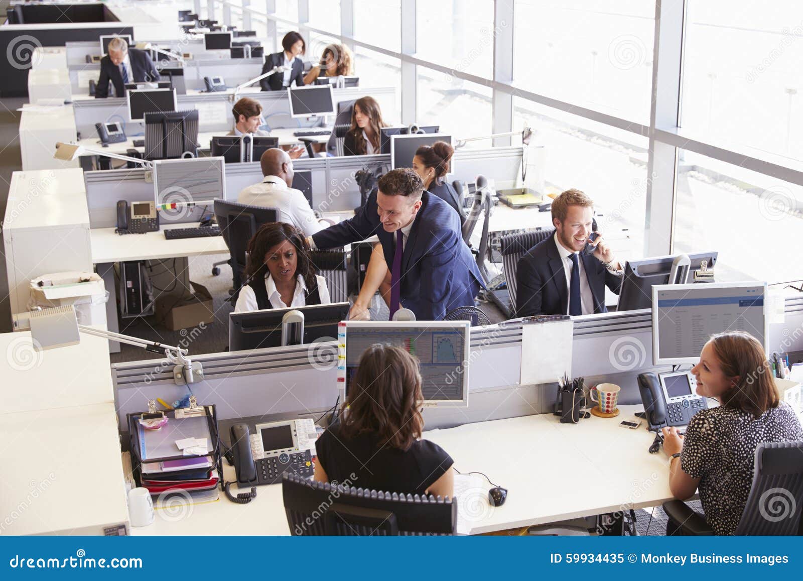 Manager in Discussion with Coworker in an Open Plan Office Stock Image ...