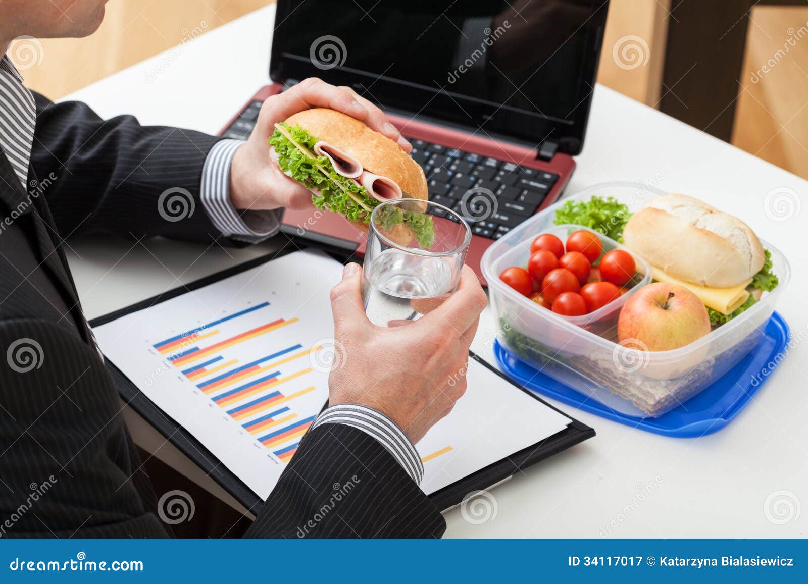 Manager Eating a Sandwich during Work Stock Image - Image of document ...