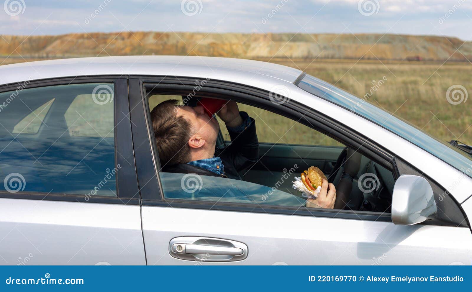 The Manager Eats Lunch at Wheel in the Car Stock Photo - Image of road ...