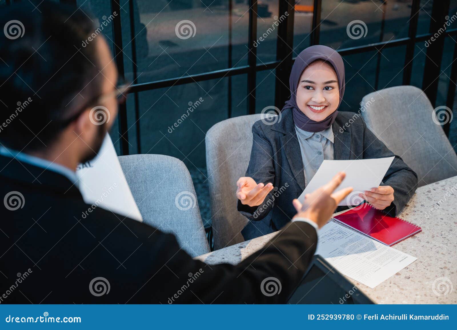 Manager and Employee Talking about the Document in the Office Stock ...