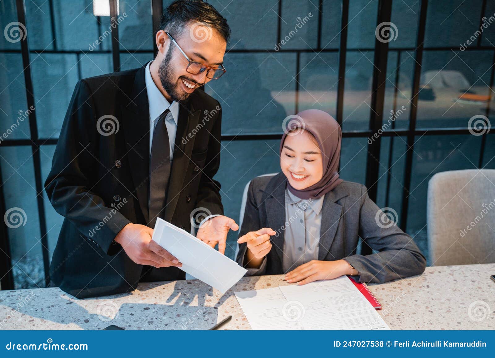 Manager and Employee Talking about the Document in the Office Together ...