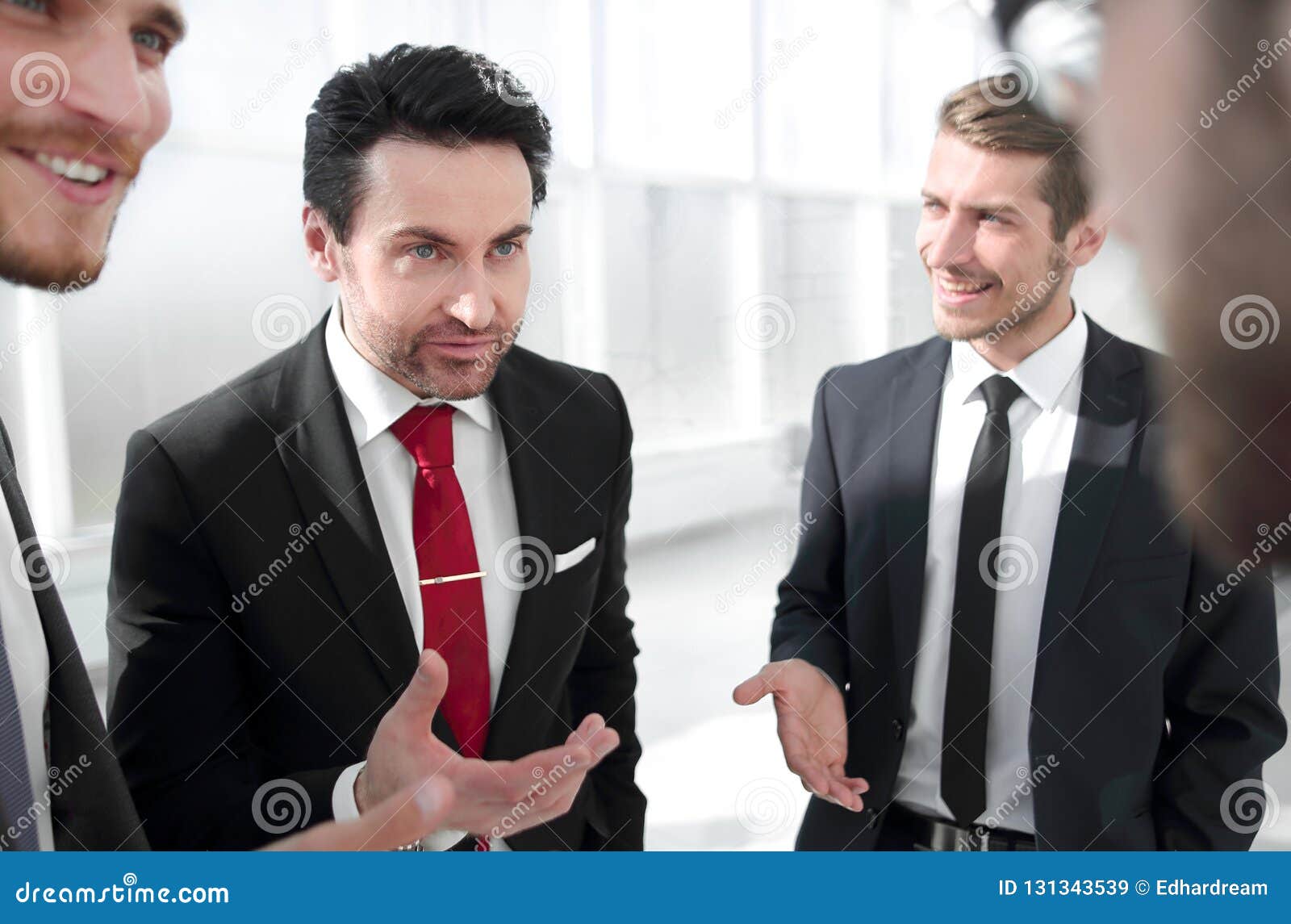 Manager and Employees of the Company Talking Standing in the Office ...