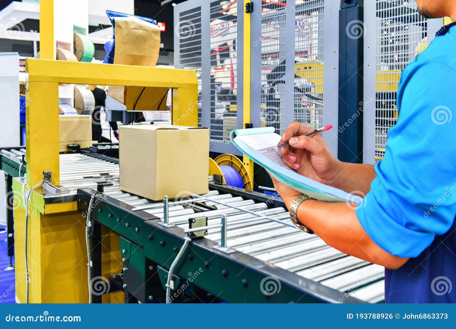 Manager Engineer Checking Cardboard Boxes on Conveyor Belt in ...