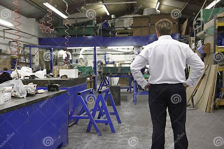 Manager on factory floor stock photo. Image of workforce - 14219484
