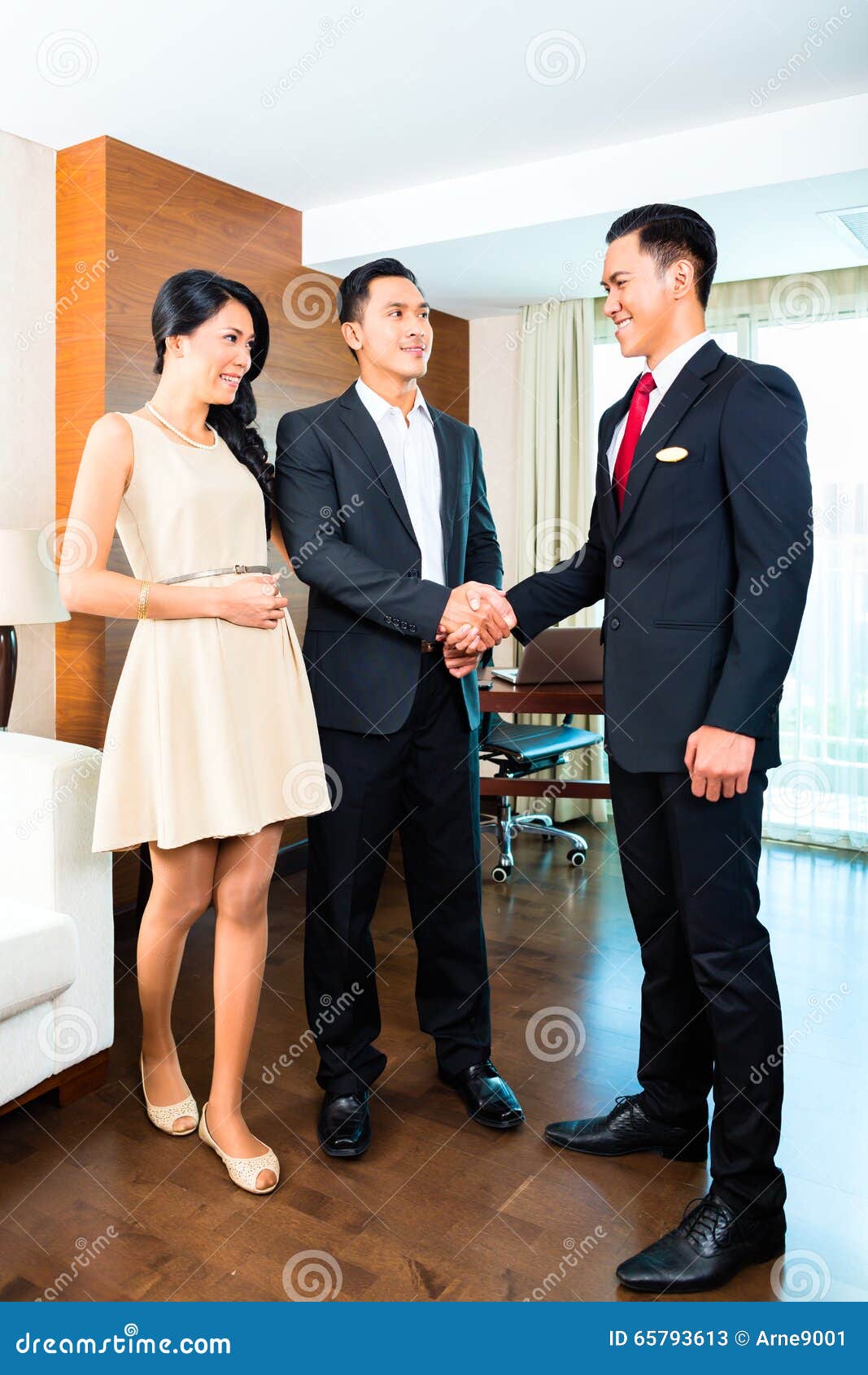 Manager Greeting Guests in Asian Hotel Stock Image - Image of asia ...