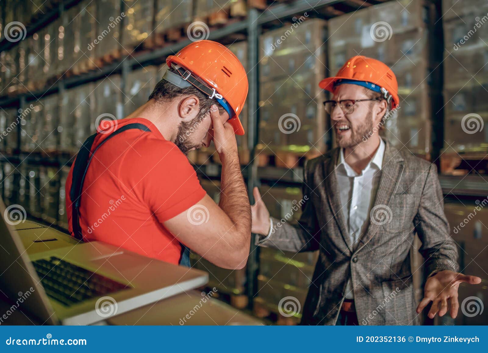 Manager Having a Conversation with the Warehouse Worker and Looking ...
