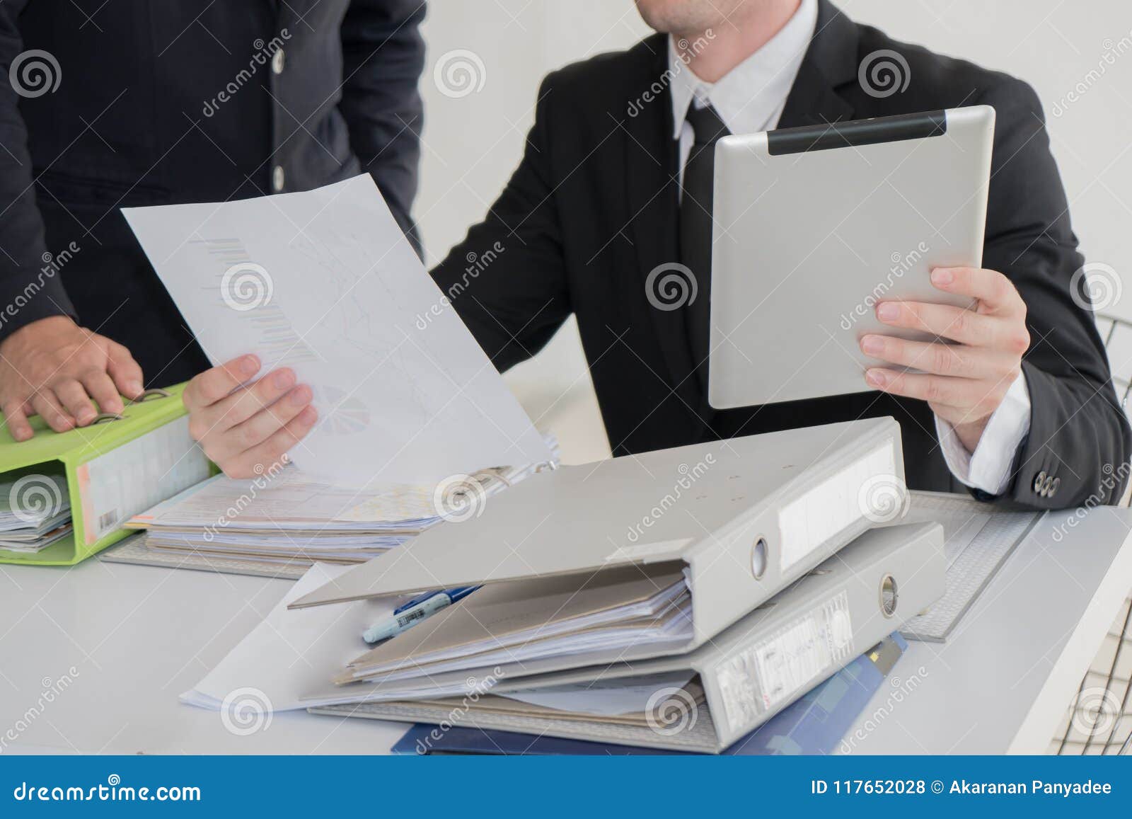 Manager Holding Report Document and Tablet To Discuss with His T Stock ...