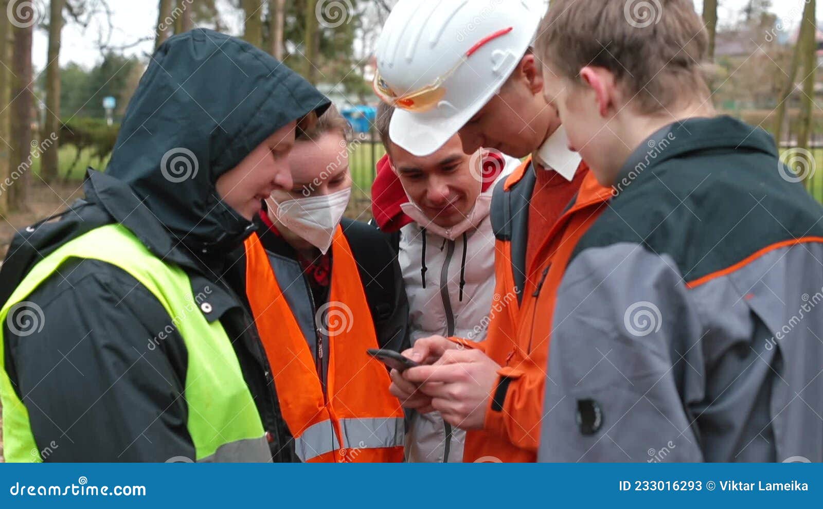 The Manager Indicates Work Plan on Phone. Workers Special Clothes ...