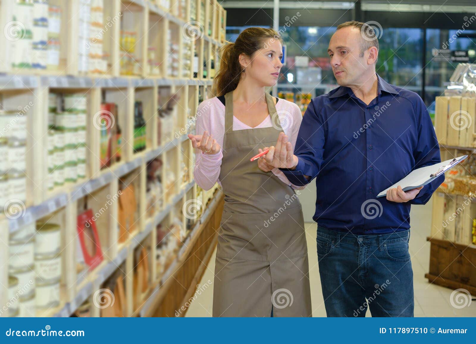 Manager Instructing Worker in Store Stock Photo - Image of defensive ...