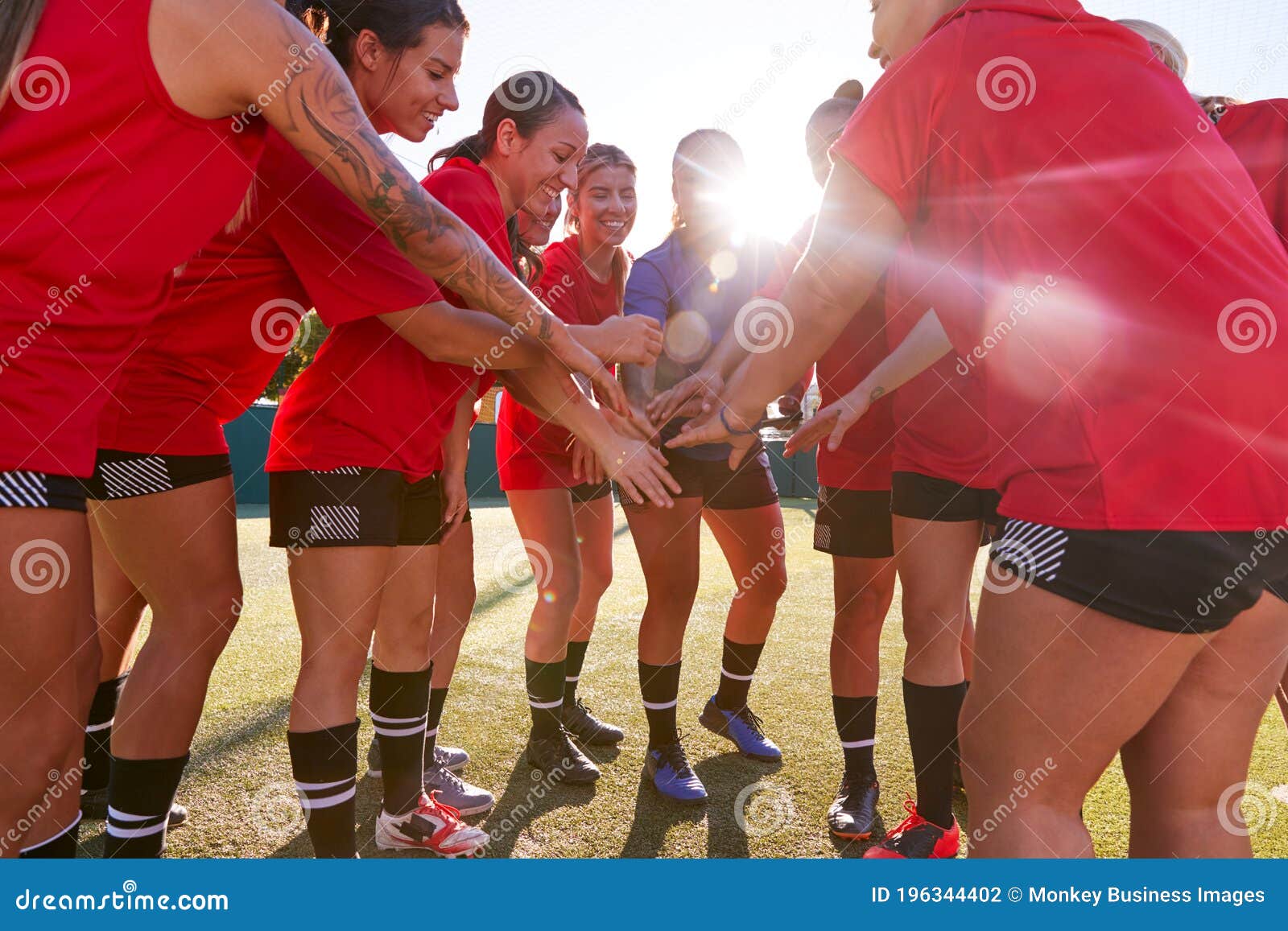 Manager Joining Hands with Womens Soccer Team during Pep Talk before ...