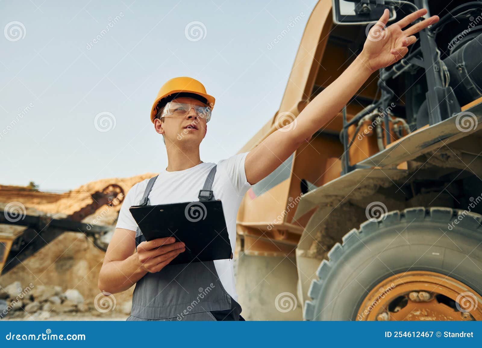 Manager Planning the Work. Man in Professional Uniform is on the Borrow ...