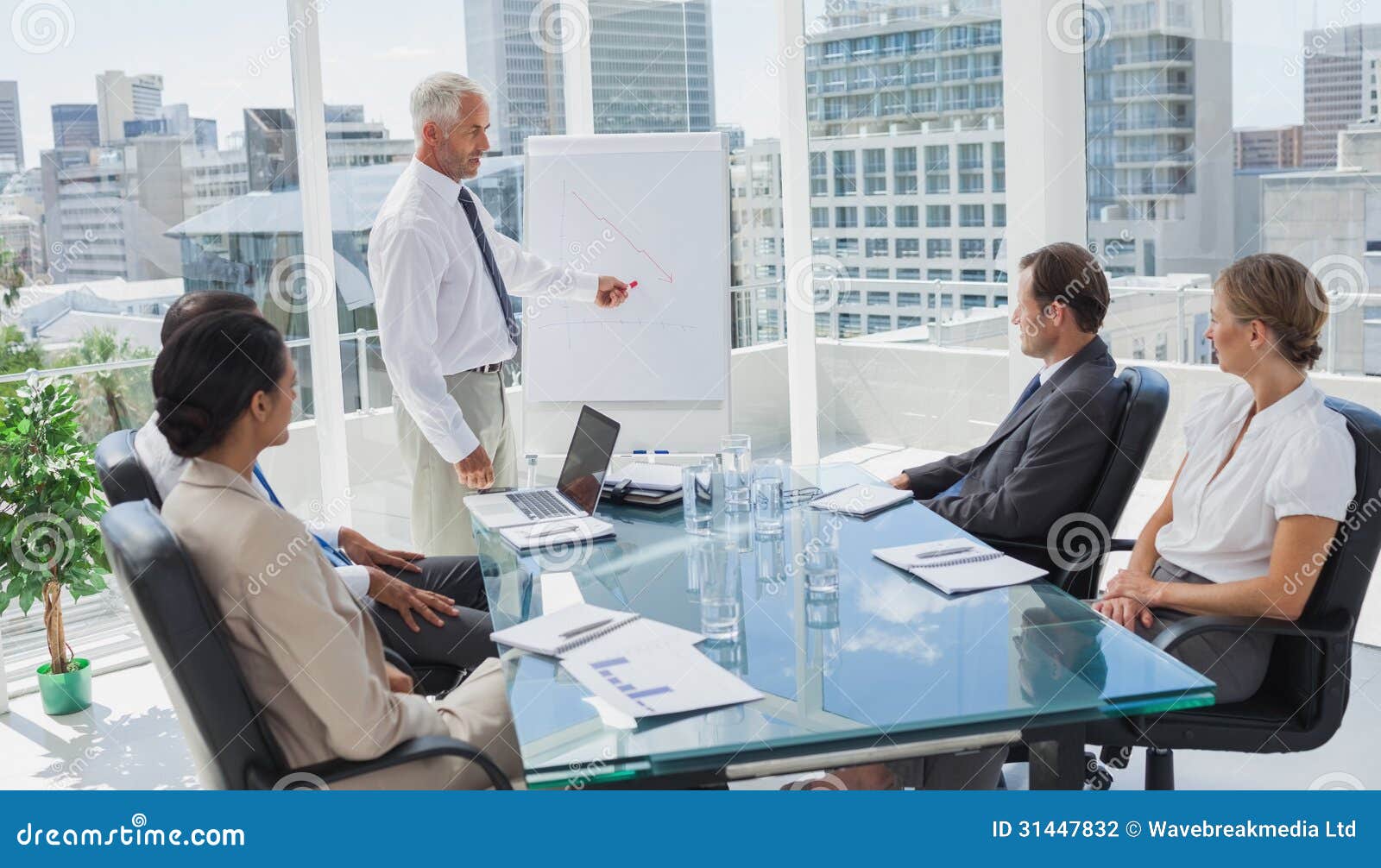 Manager Pointing at a Chart during a Meeting Stock Photo - Image of ...