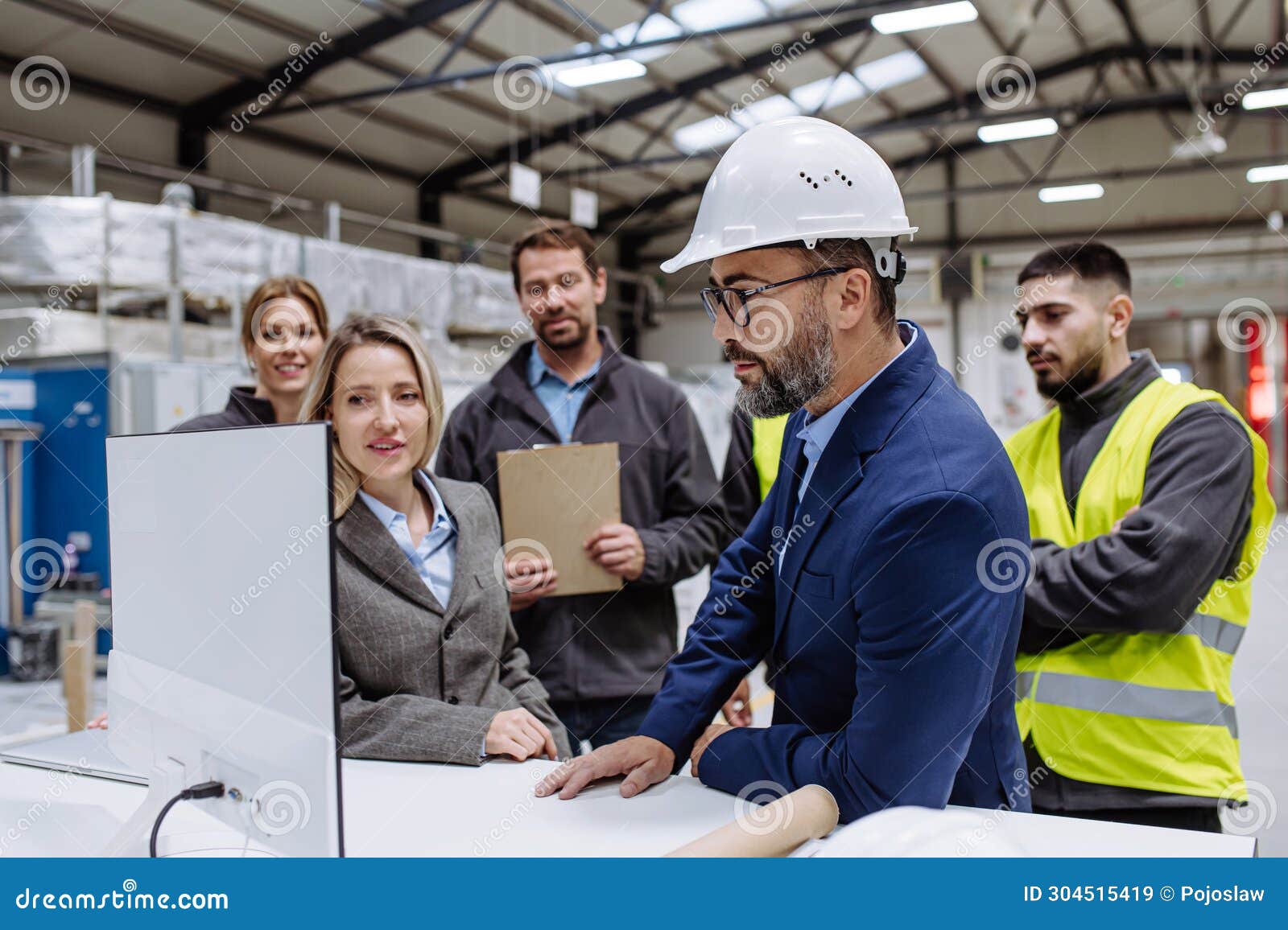 Manager Presenting Project To Full Team of Warehouse Employees on ...