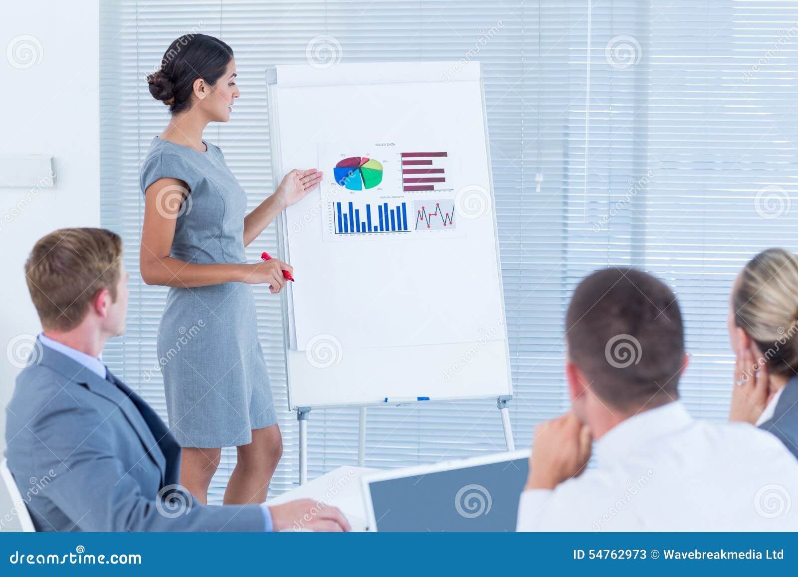 Manager Presenting Statistics To Her Colleagues Stock Image - Image of ...