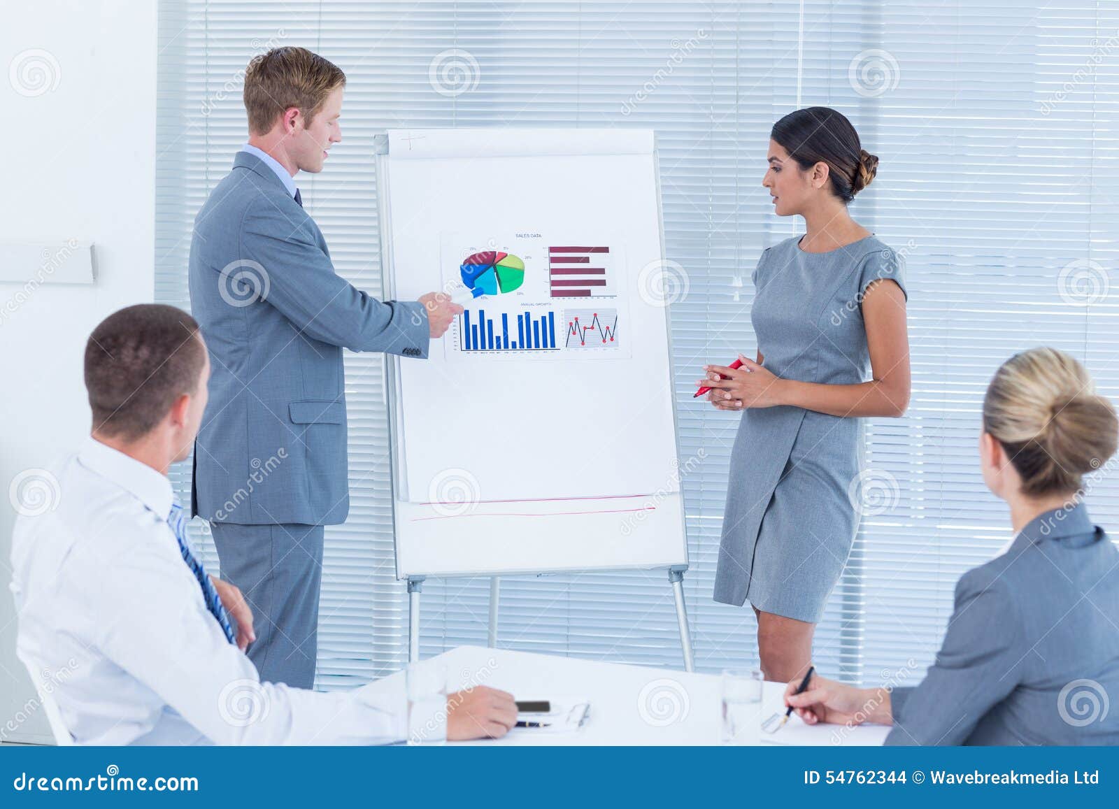 Manager Presenting Statistics To His Colleagues Stock Photo - Image of ...