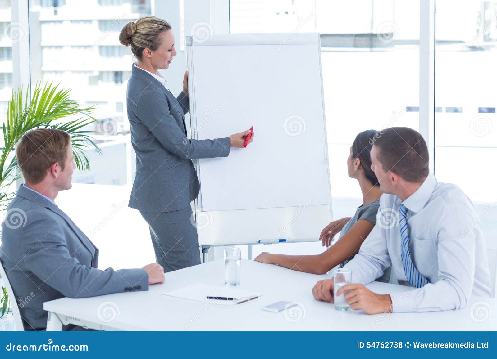 Manager Presenting Whiteboard To His Colleagues Stock Photo - Image of ...