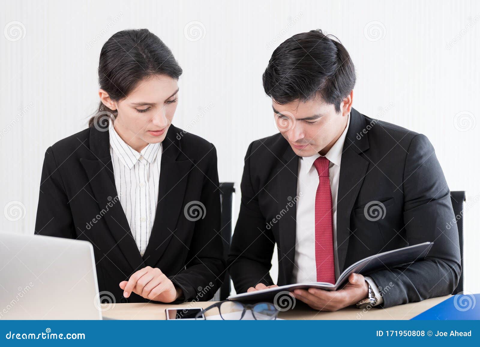 A Manager and Secretary Working Together in the Office Stock Photo ...