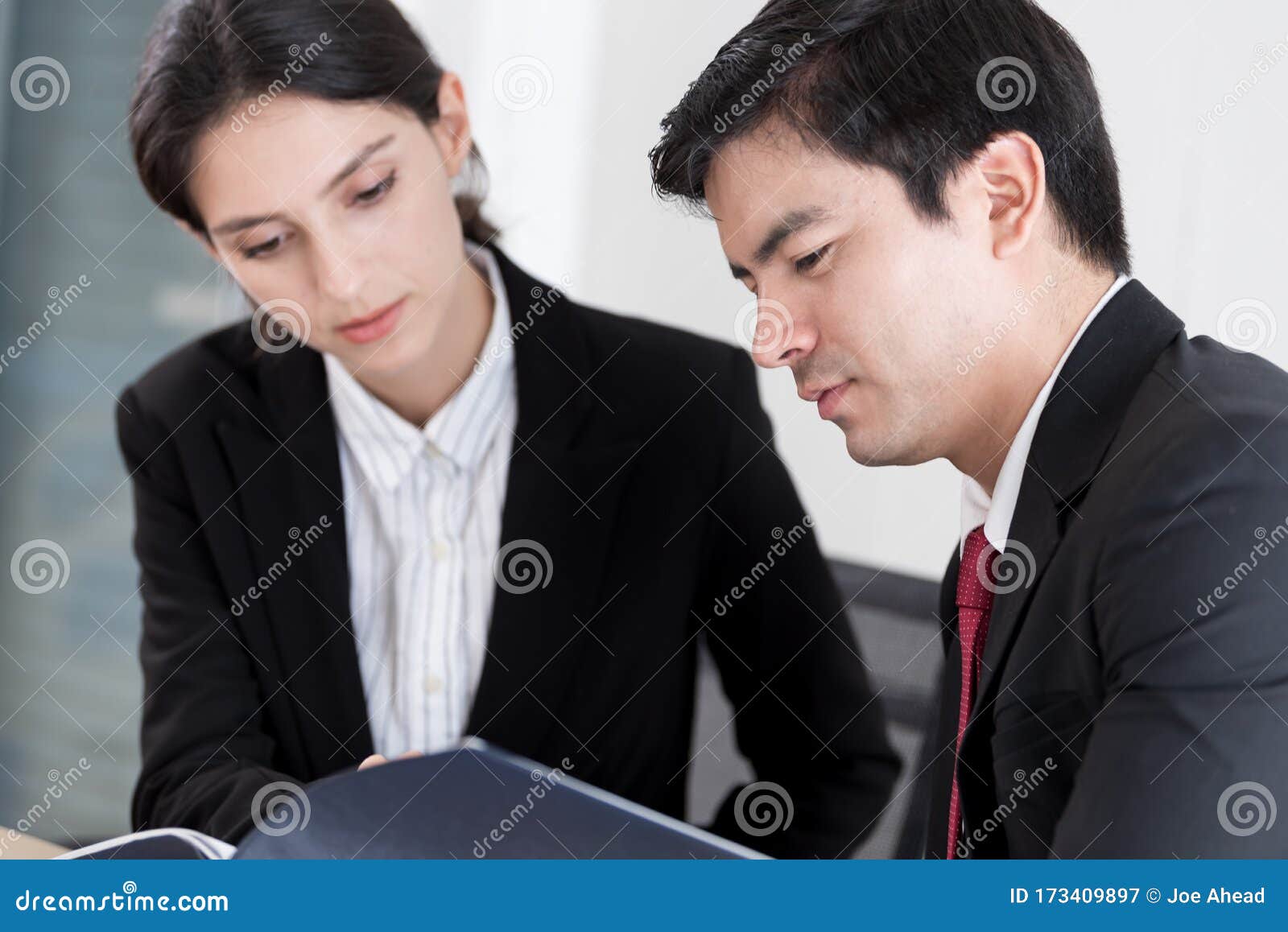 A Manager and Secretary Working Together in the Office Stock Image ...