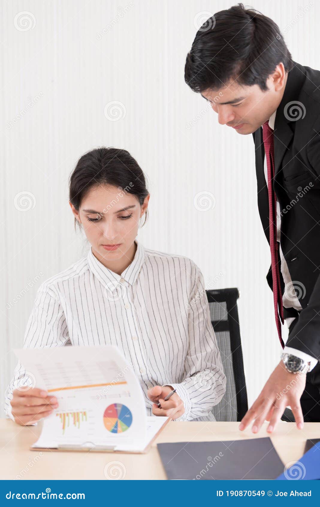 A Manager and Secretary Working Together in the Office Stock Image ...