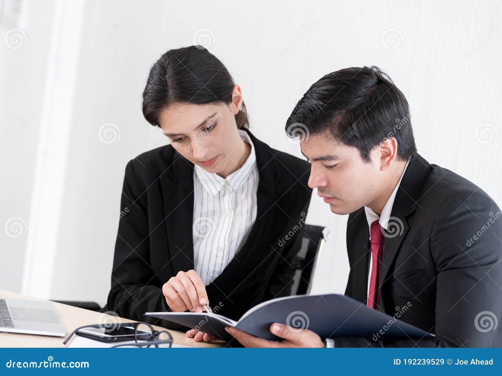 A Manager and Secretary Working Together in the Office Stock Image ...