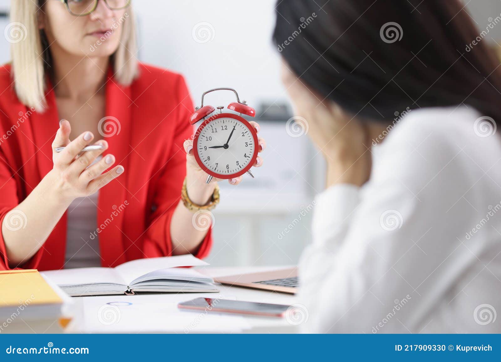 Manager Shows Alarm Clock To Subordinate, Fixing Delay for Work Stock ...