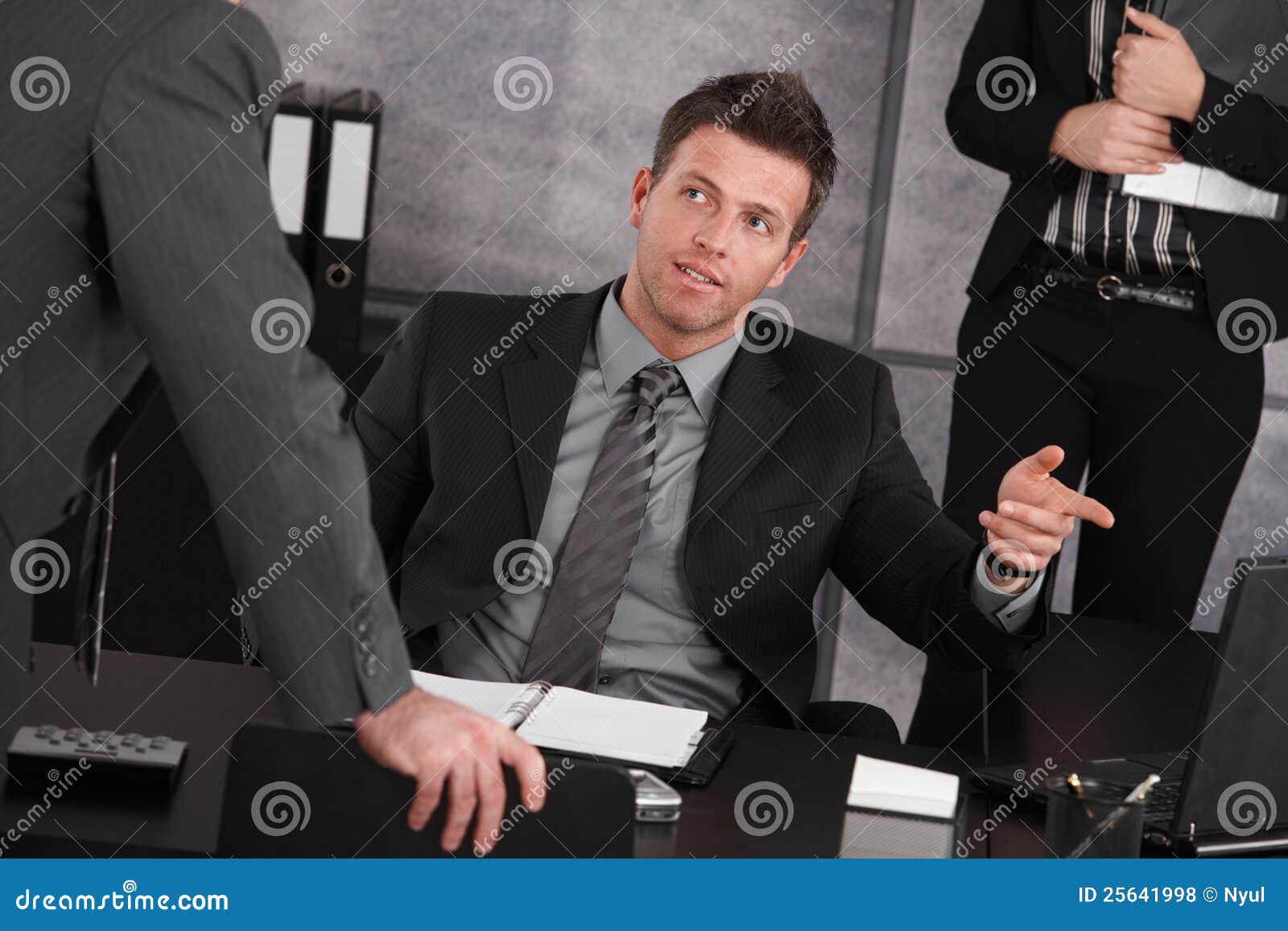 Manager Sitting at Desk, Teaching Employee Stock Photo - Image of ...