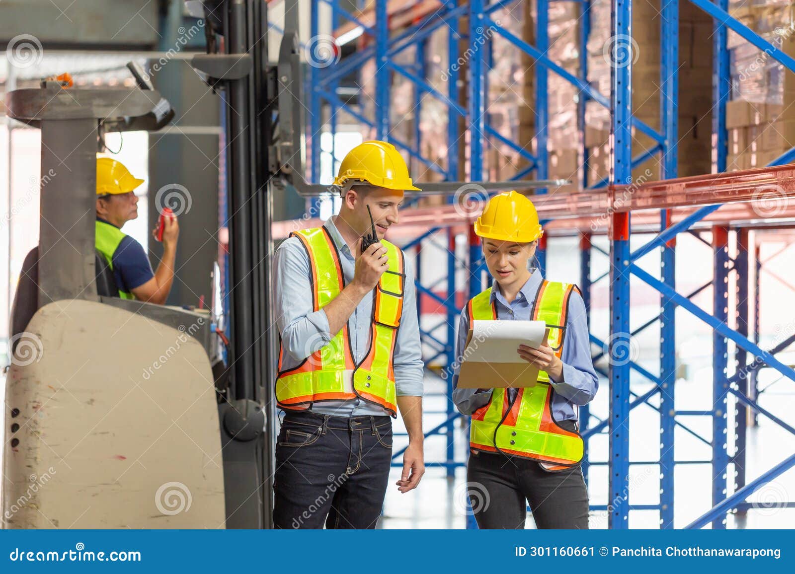 Manager and Supervisor Taking Inventory in a Warehouse, Workers Team ...