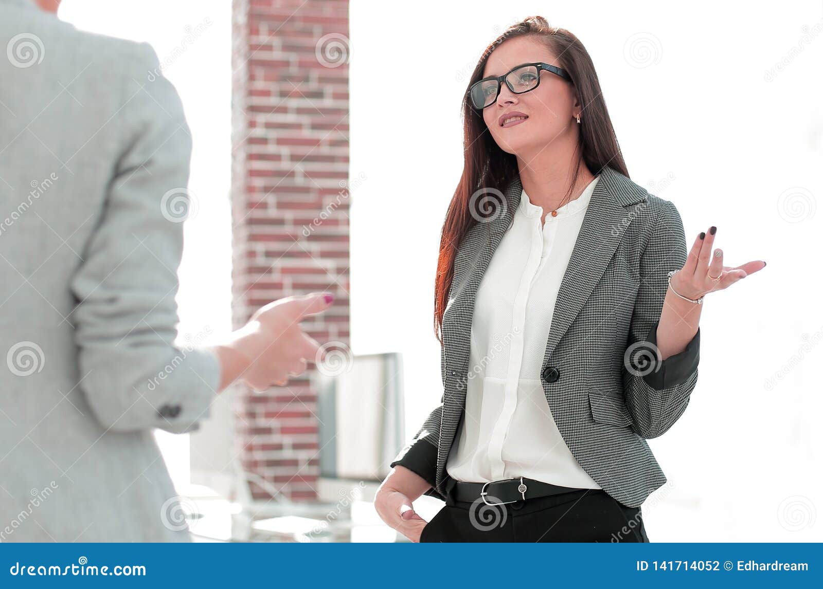 Manager Talking with a Client Standing in the Office Stock Photo ...