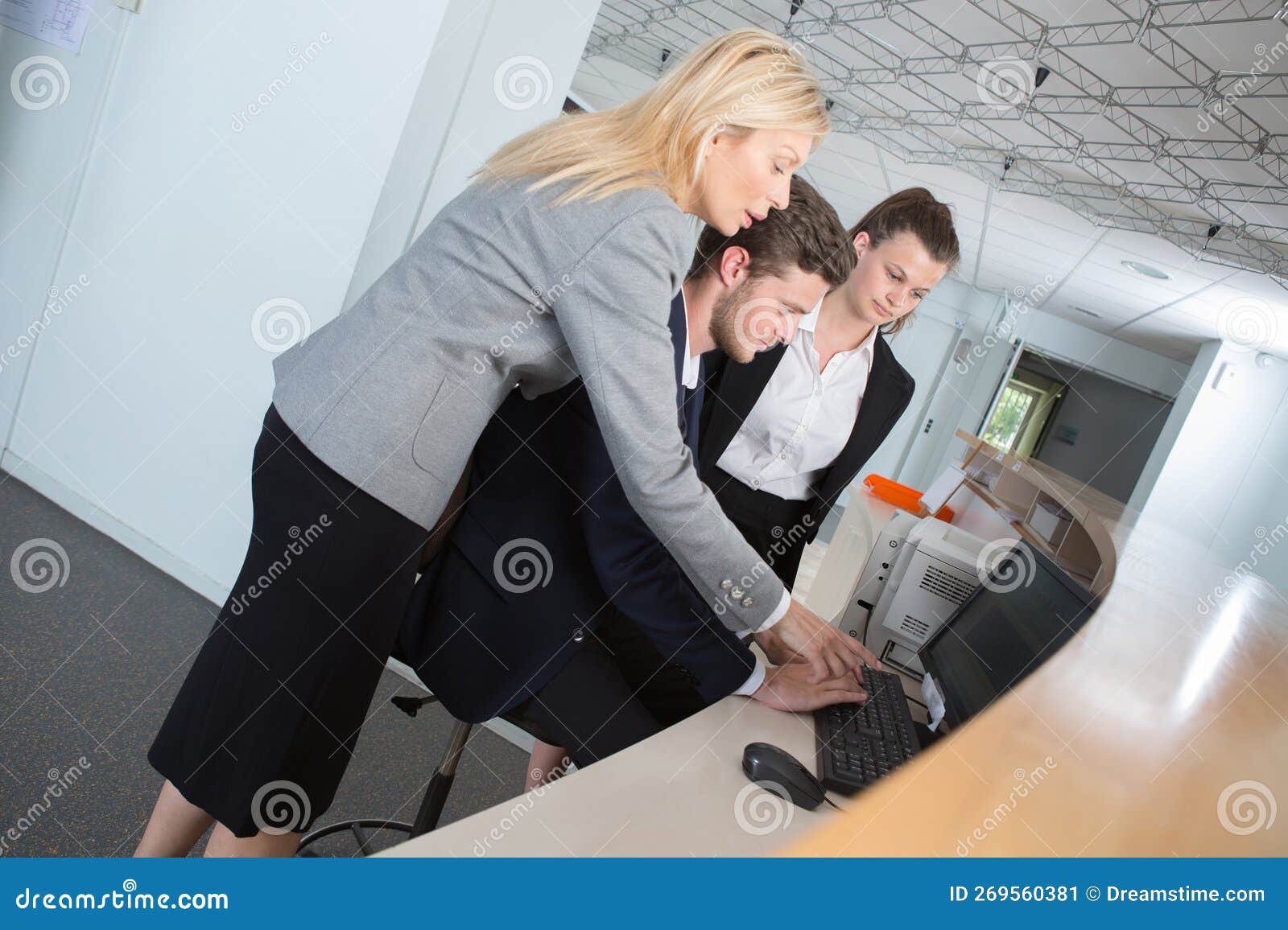 Manager Training Staff Behind Reception Desk Stock Image - Image of ...