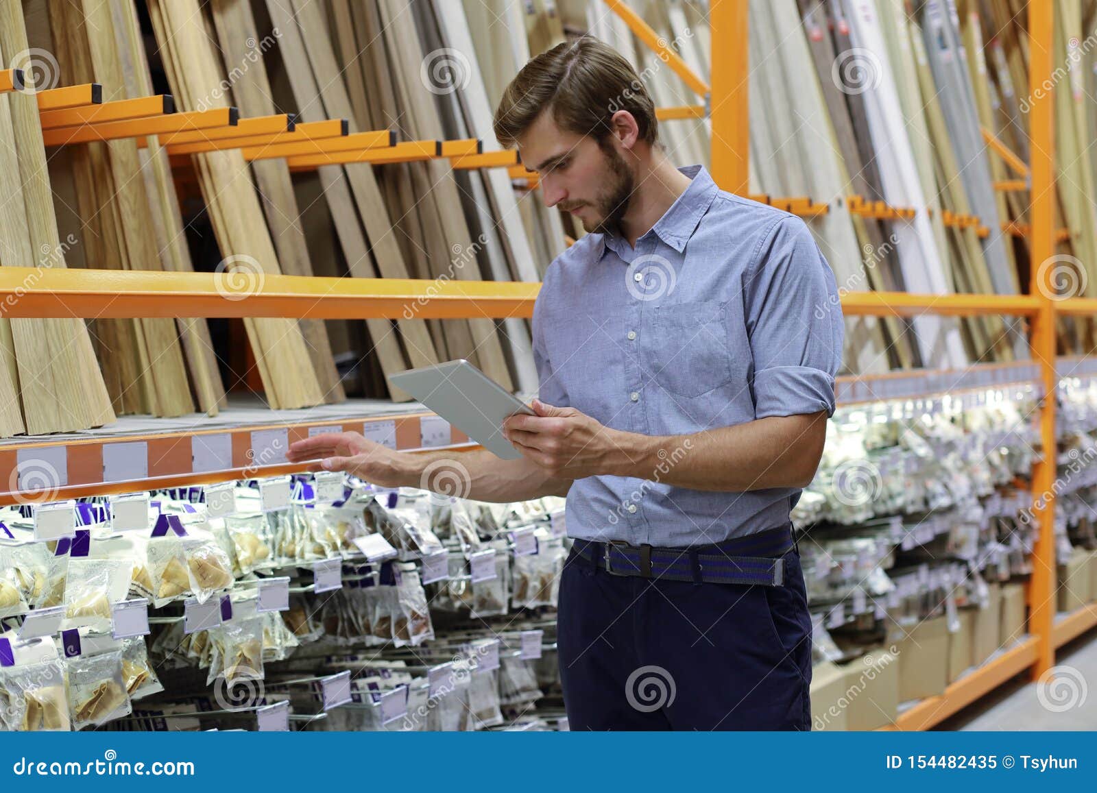 Manager Use His Tablet for Online Checking Products Available Stock ...