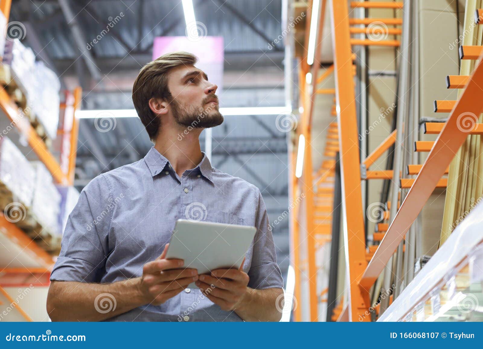 Manager Use His Tablet for Online Checking Products Available Stock ...